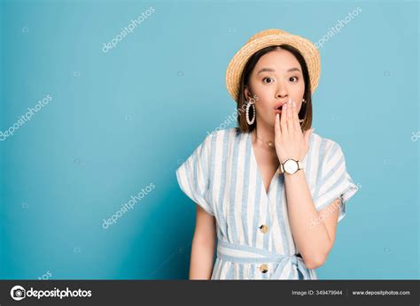 Shocked Brunette Asian Girl Striped Dress Straw Hat Covering Mouth