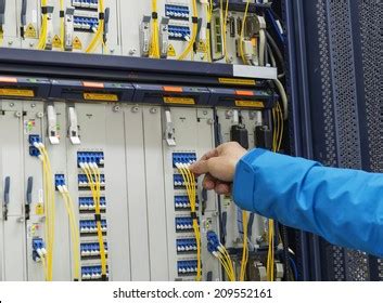 Man Connecting Network Cables Switches Stock Photo Shutterstock