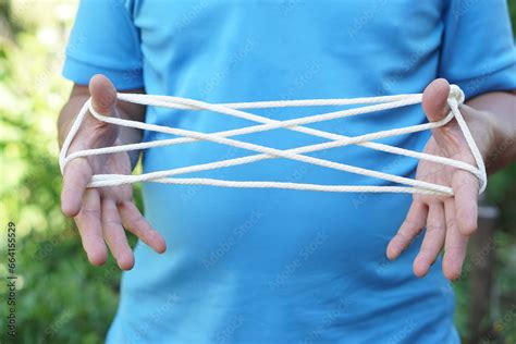 Closeup Man Hands Is Playing Rope Which Called Cats Cradle Game