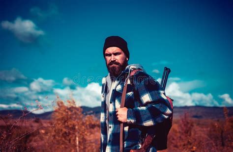 Hunter With Shotgun Gun On Hunt Bearded Hunter Man Holding Gun And