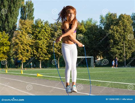 A Teenage Girl Jumping Rope In A School Stadium Stock Image Image Of