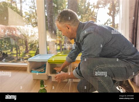 Man Sorting Waste Into Waste Separation Bin Stock Photo Alamy