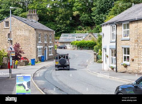 Land Rover Defender Driving Through Edgworth Village On The Bolton Road
