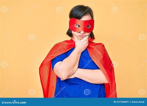 Brunette Woman With Down Syndrome Wearing Super Hero Costume Thinking