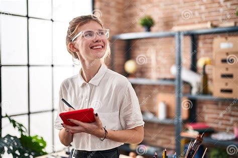 Young Blonde Woman Artist Smiling Confident Drawing On Touchpad At Art