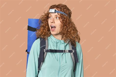 Premium Photo Young Caucasian Redhead Ready For Hiking With Gear