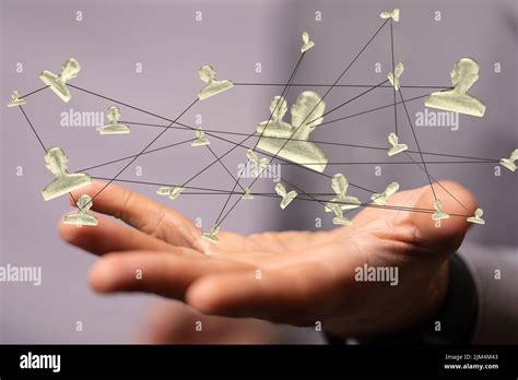 A Person S Hand With Illustrative People Icons Floating Above A Hand Concept Of Communication