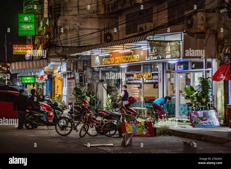 Young Thai Outside Of A Massage Parlor At Night In Chiang Rai Thailand