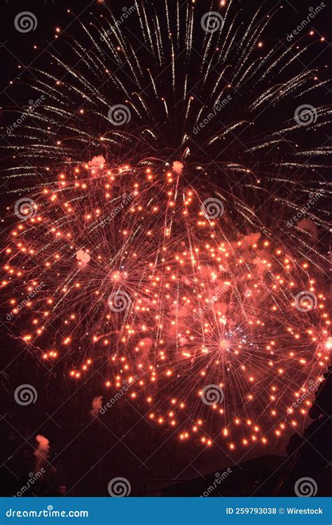 Night Sky With Red Glowing Fireworks Concept Of Celebration And