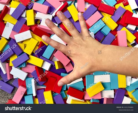 Hand Grabbing Colourful Wooden Blocks Stock Photo 2211783891 Shutterstock