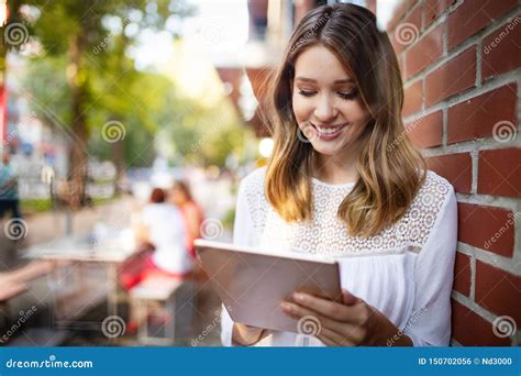 Beautiful Brunette Girl Using Tablet For Work Freelance Blogging