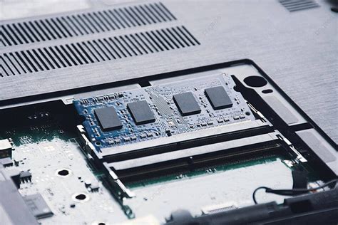 Inserting Ram Into Laptops Motherboard Memory Slot For Improved