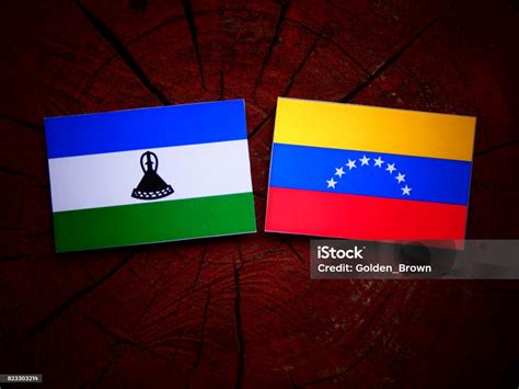 Stock Fotografie Lesotho Vlajka S Venezuelskou Vlajkou Na Pařezu Stromu