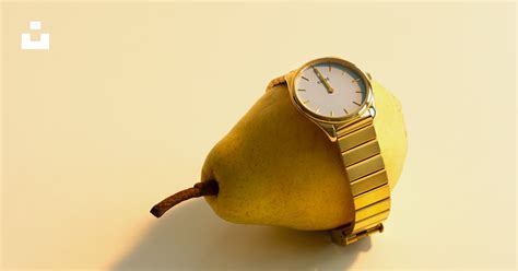 A Pear With A Watch On Top Of It Photo Free Experimental Image On Unsplash