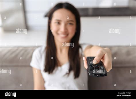 Woman Holding Tv Remote Hi Res Stock Photography And Images Alamy