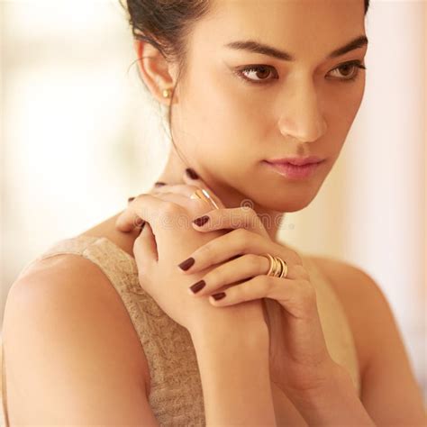 Her Beauty Is Striking A Beautiful Young Woman Dressed Elegantly In
