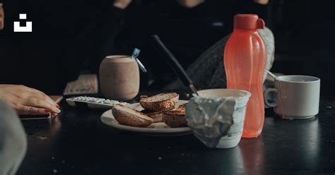 Sliced Bread On White Ceramic Plate Beside Orange Plastic Bottle Photo