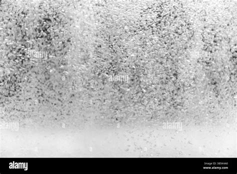 Small Water Bubbles On A Black Background Comming From Below In An Small Water Bubbles On A Black Background Comming From Below In An