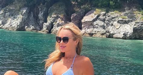 Amanda Holden Demonstrates Her Toned Physique In A Sizzling Blue Bikini