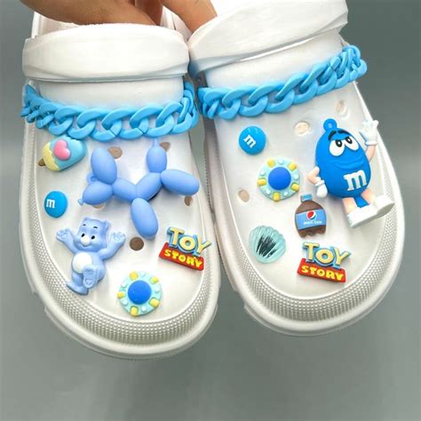 Crocs รองเท้ามีเสน่ห์ Jibbilz 14ชิ้นเซ็ตหัวเข็มขัดรองเท้า Diy อุปกรณ์