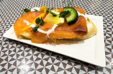 Delicious Smoked Salmon Open Sandwich With Cucumber And Lemon Garnish