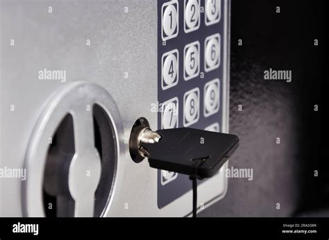 Key Is Inserted In Lock Of Safe Stock Photo Alamy