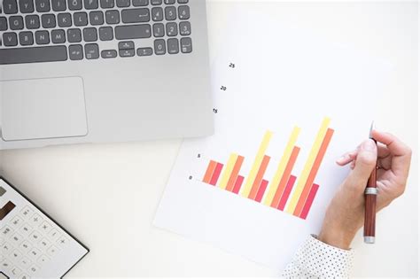 Premium Photo Hands Of A Middleaged Woman Working With A Laptop Computer Analyzing A Graph And