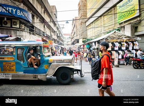Classic Jeepneys Make Their Way Through The Congested Market In The