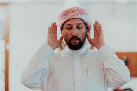 Premium Photo A Group Of Muslims In A Modern Mosque Praying The
