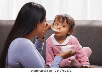Mother Feeding Her Baby Spoon Living Stock Photo 2140752671 Shutterstock