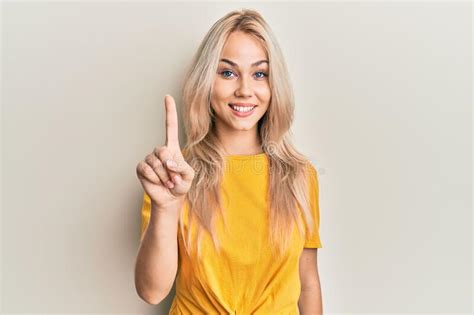 Beautiful Caucasian Blonde Girl Wearing Casual Tshirt Showing And