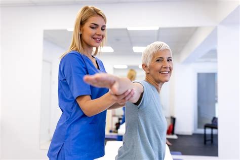Premium Photo Doctor Orthopedic Teaching Senior Woman To Do