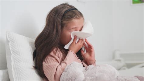 Sick Girl Blowing Runny Nose Into Tissue Paper At Home 47346566 Stock