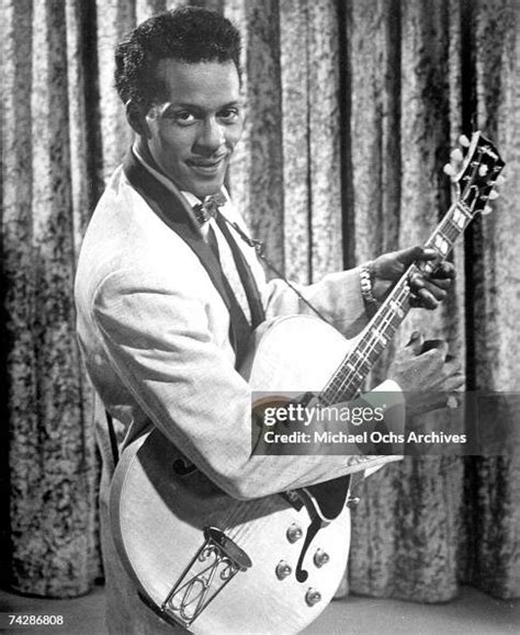 Rock And Roll Musician Chuck Berry Poses For A Portrait Holding A