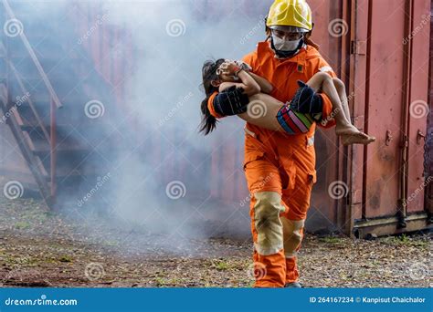 Firefighter To Save Girl In Fire And Smoke Rescue Team Or Firefighters