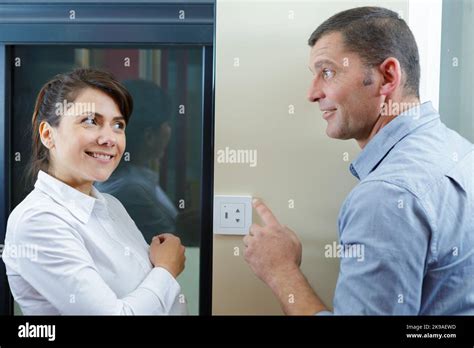 Couple Next To Electric Switch Stock Photo Alamy