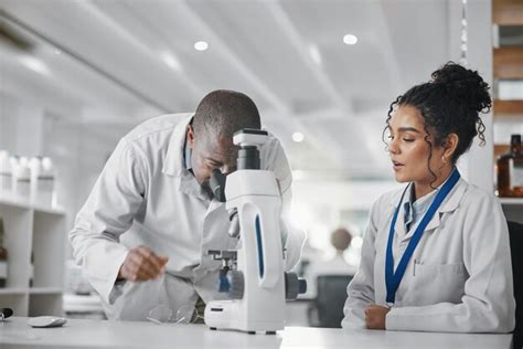 Premium Photo Teamwork Microscope And Scientist In Laboratory For Analysis Innovation Or