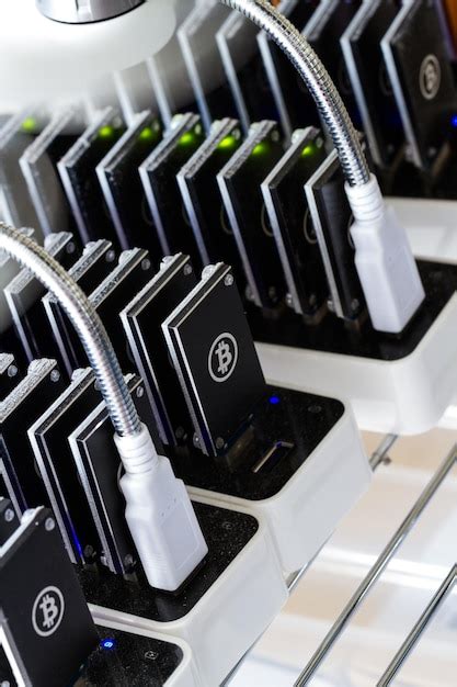 Premium Photo Bitcoin Mining Usb Devices In A Row With Small Fans