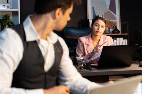 Focusing On Woman Presenting Graph While Man Holding Paper To Sign Postulate Stock Image