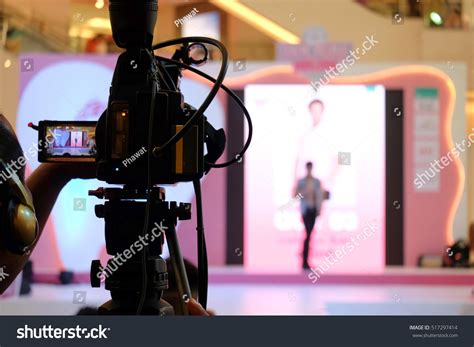 Photographer Video Recording Activity Within Event Stock Photo