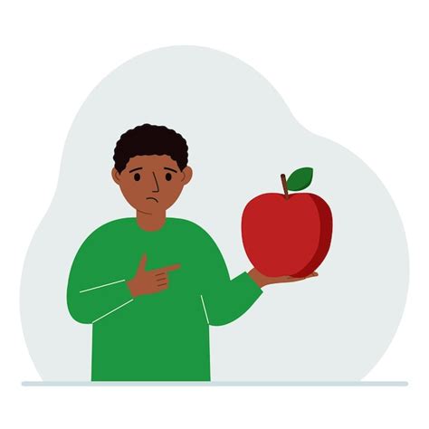 Un Niño Sostiene Una Manzana Fresca Y Roja En La Mano El Niño Come Una