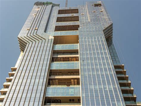 Glass Covered Multi Storied Office Building Behind The 30 Feet High