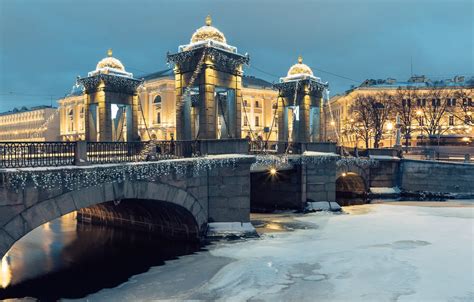 Обои зима, снег, деревья, мост, город, огни, река, здания, дома, лёд ...