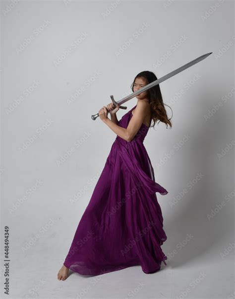 Full Length Portrait Of Pretty Brunette Asian Girl Wearing Purple