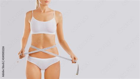Slim Woman In Lingerie With A Centimeter Stock Photo Adobe Stock
