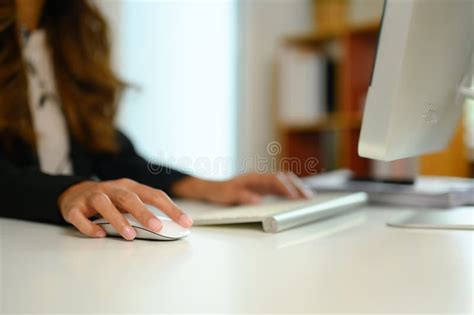 Cropped Shot Of Female Manager Clicking Wireless Computer Mouse And