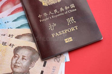 Red Passport Of People Republic Of China And Chinese Yuan Money Bills