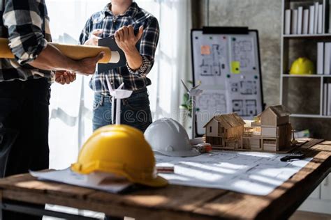 Architect Team Working With Blueprints For Architectural Plan Engineer Sketching A Construction