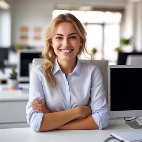 Premium AI Image A Woman Sits In Front Of A Computer With A Smile On