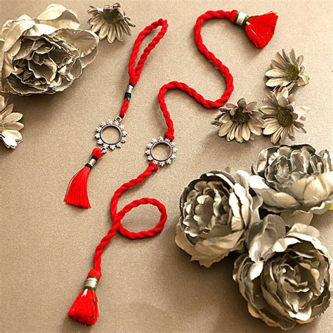Buysend Sneh Floral Bhaiya Bhabhi Silver Rakhi Set Online Fnp